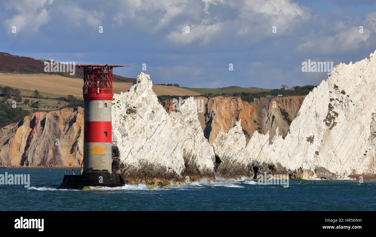 Imposing red and white Trinity Lighthouse tipping the familiar Needles ...