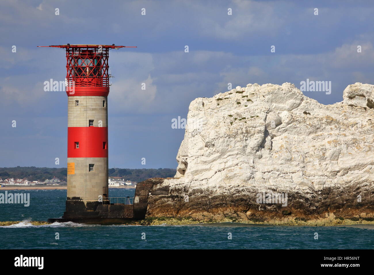 Imposing red and white Trinity Lighthouse tipping the familiar Needles ...