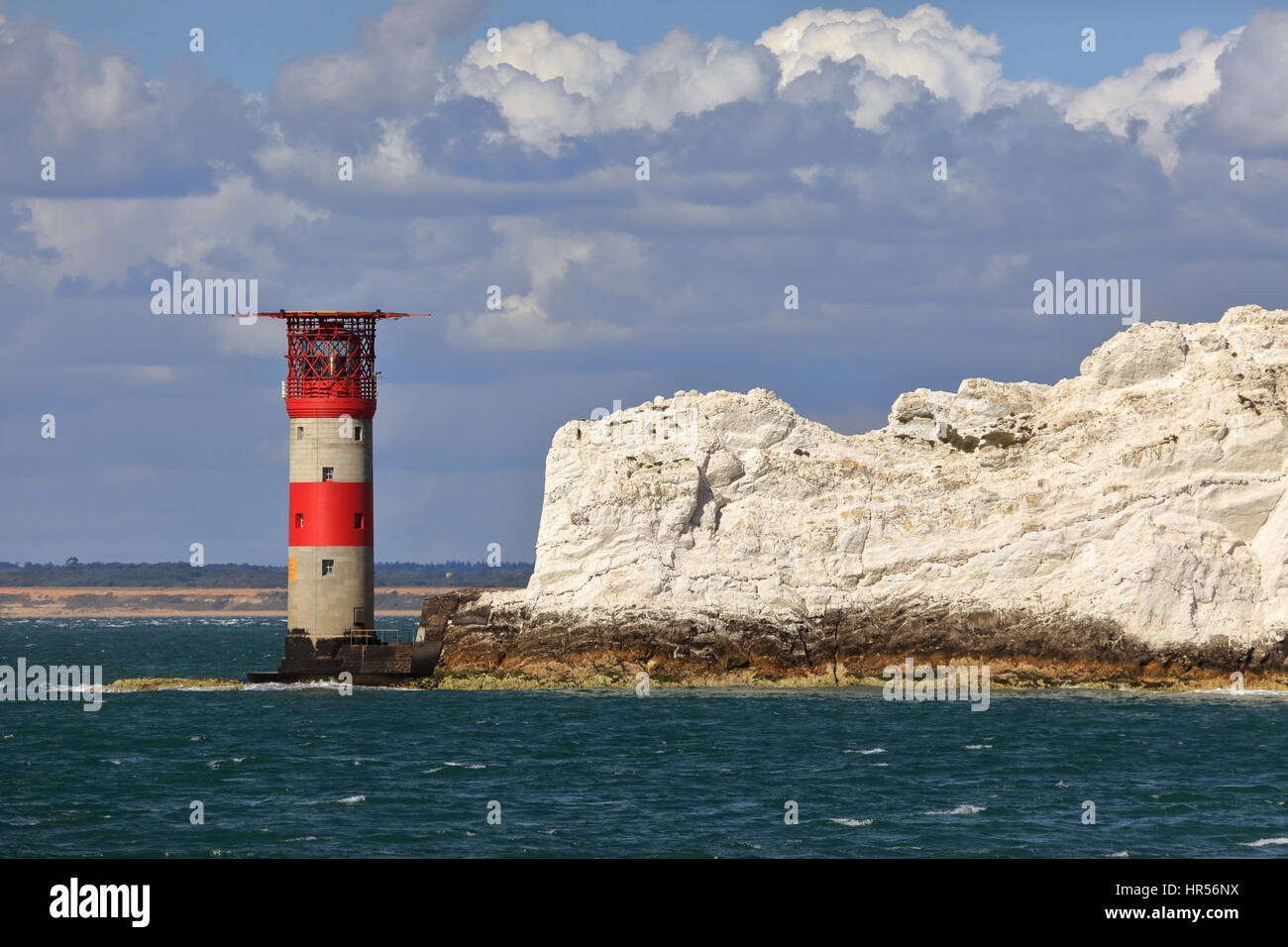 Imposing red and white Trinity Lighthouse tipping the familiar Needles ...
