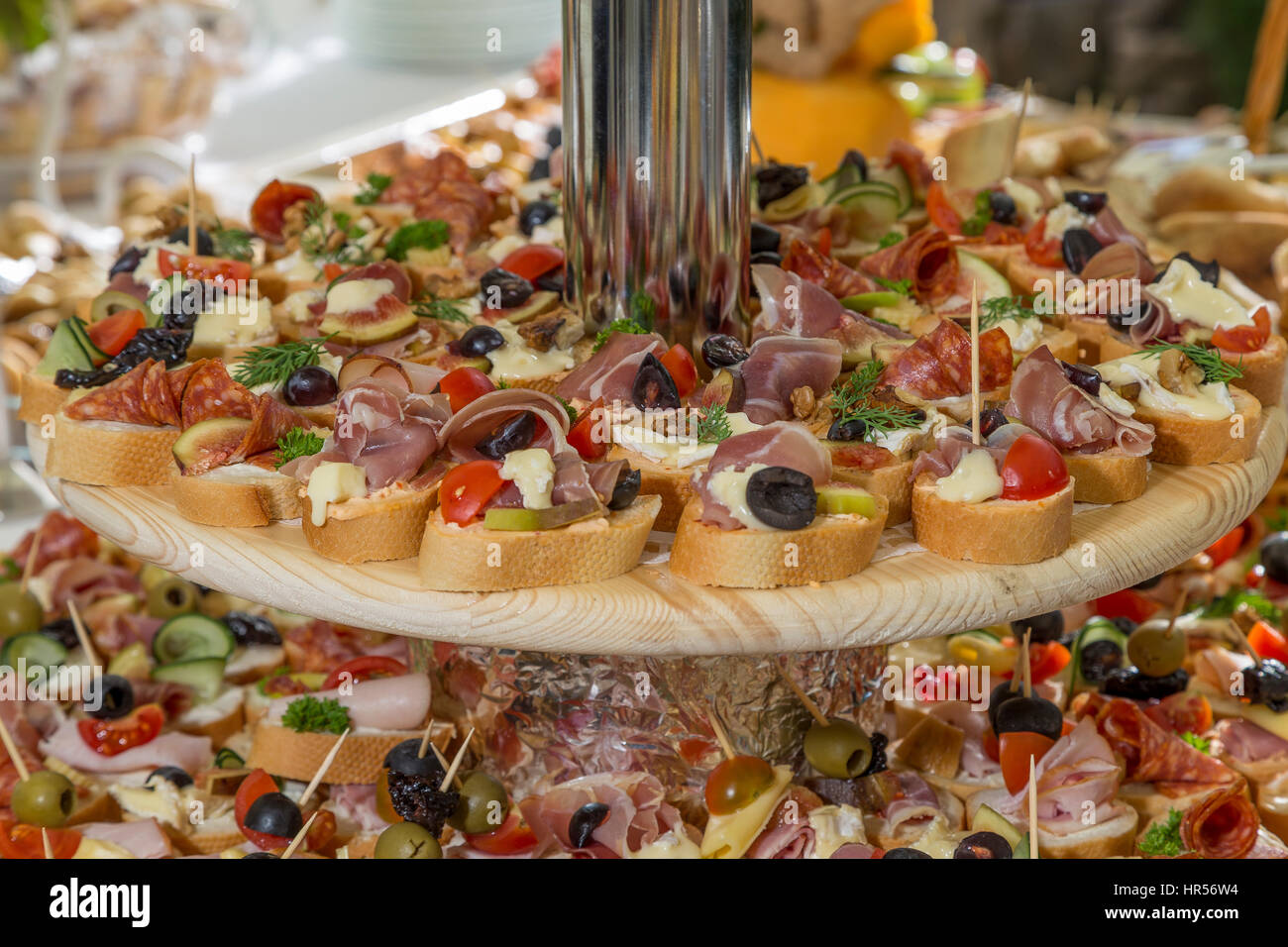 Canape sandwiches stacked on a wooden tray Stock Photo - Alamy