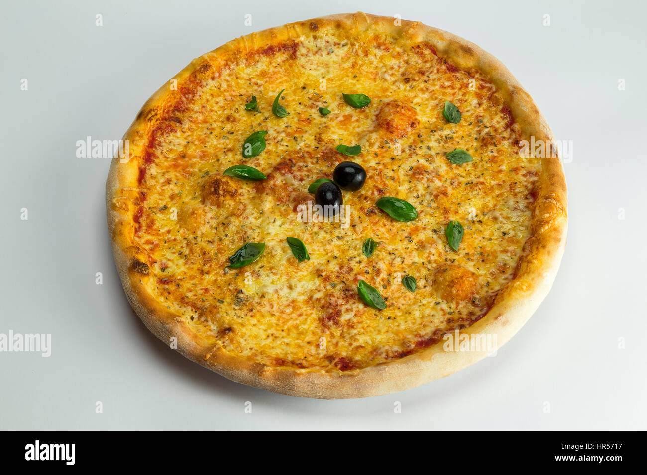 Pizza served on a table in a plate Stock Photo - Alamy