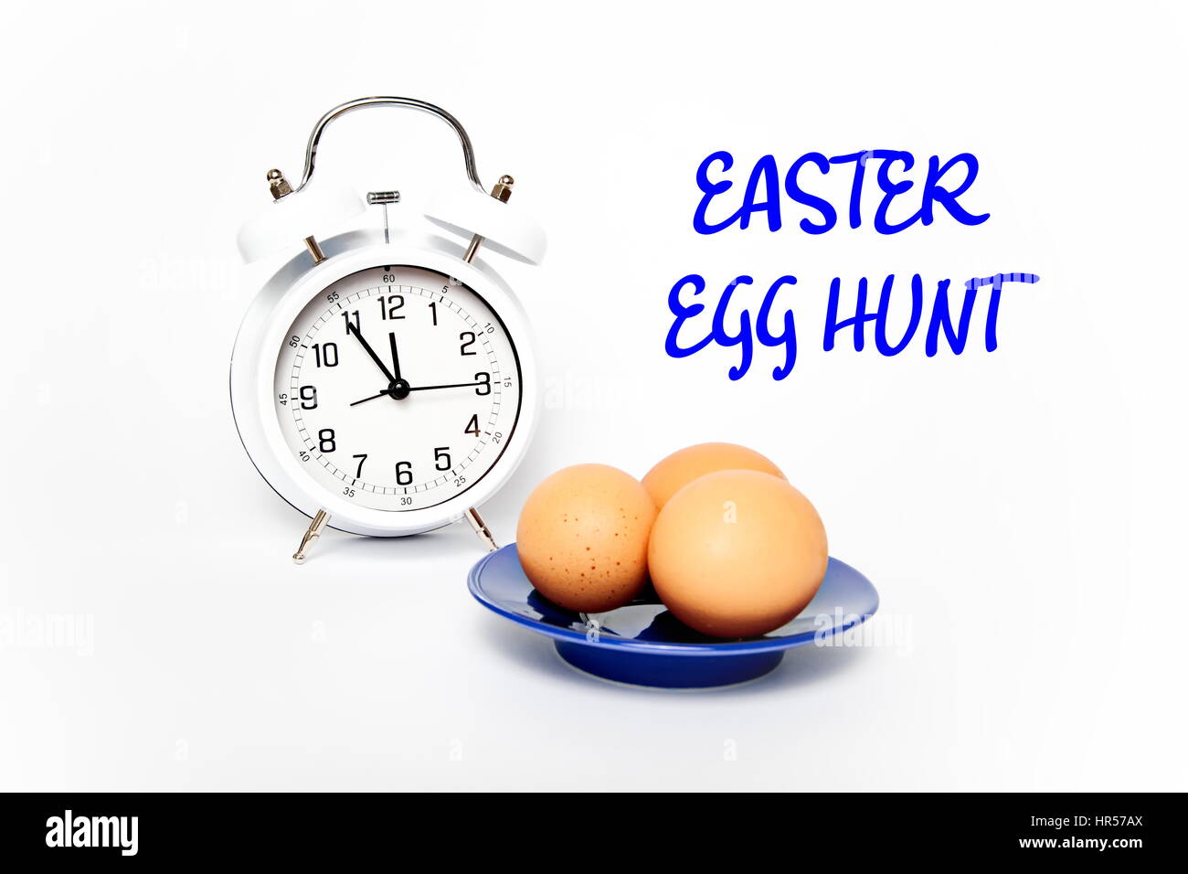 Old clock and eggs for Easter with message EASTER EGG HUNT Stock Photo ...
