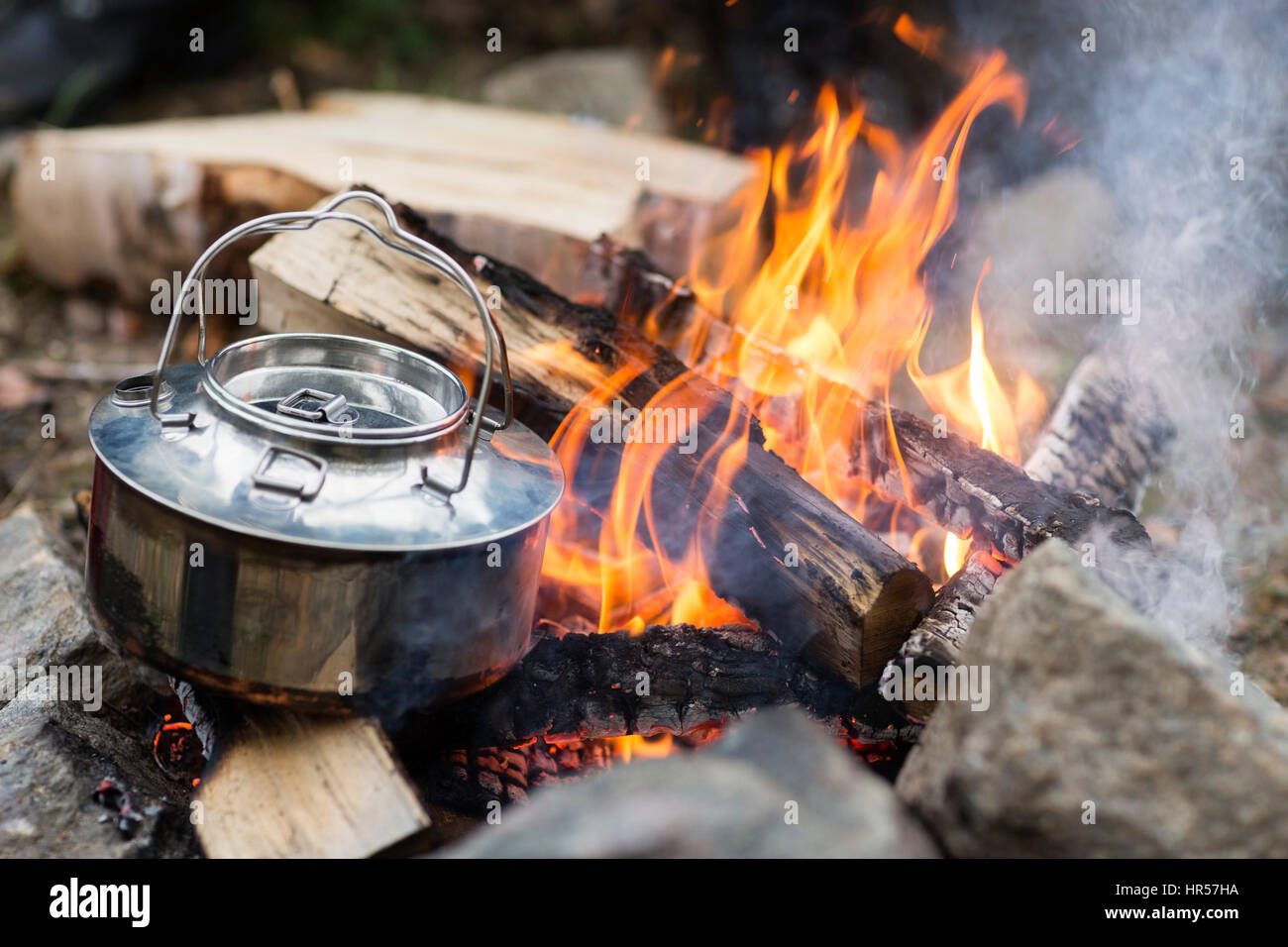 Closeup of metallic pot on bonfire at campsite Stock Photo - Alamy