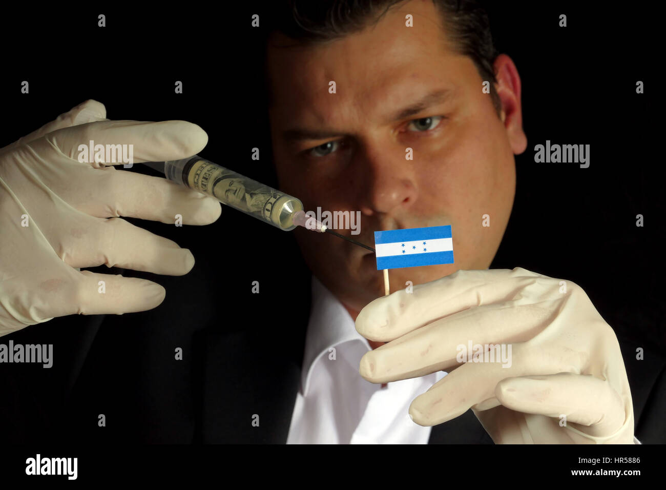 Young businessman gives a financial injection to Honduran flag isolated ...