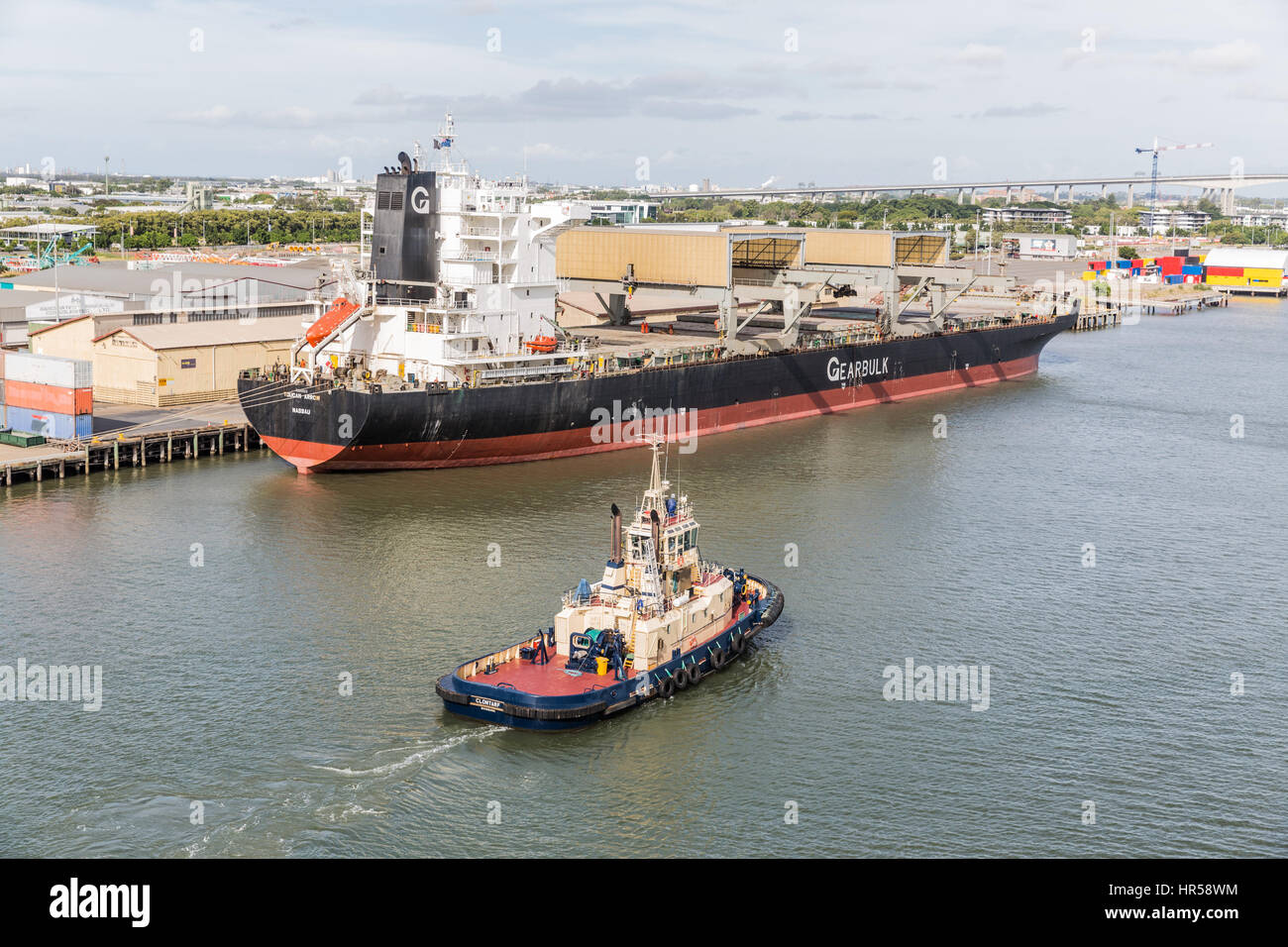 Tug "Clontarf" passes Tucan Arrow bulk carrier docked at whalf in ...