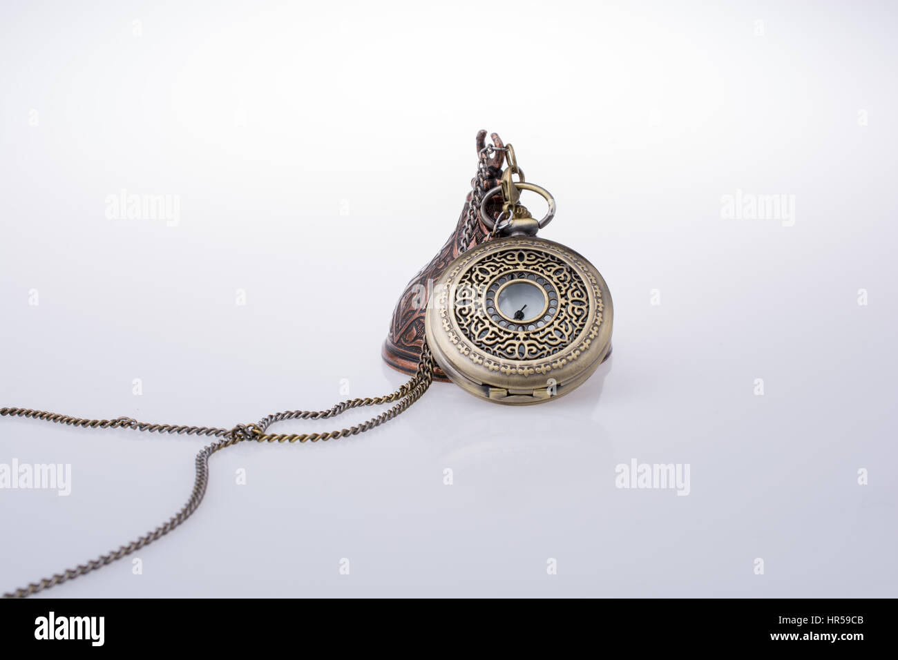 Retro style pocket watch on white background Stock Photo - Alamy