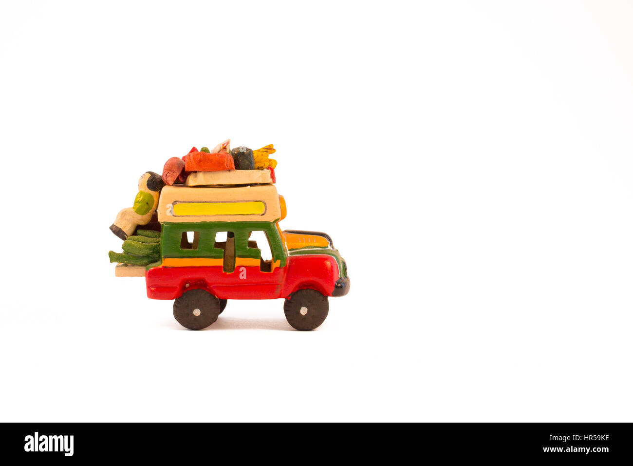 Minature model of a traditional Colombian bus (chiva). Sideview, white ...