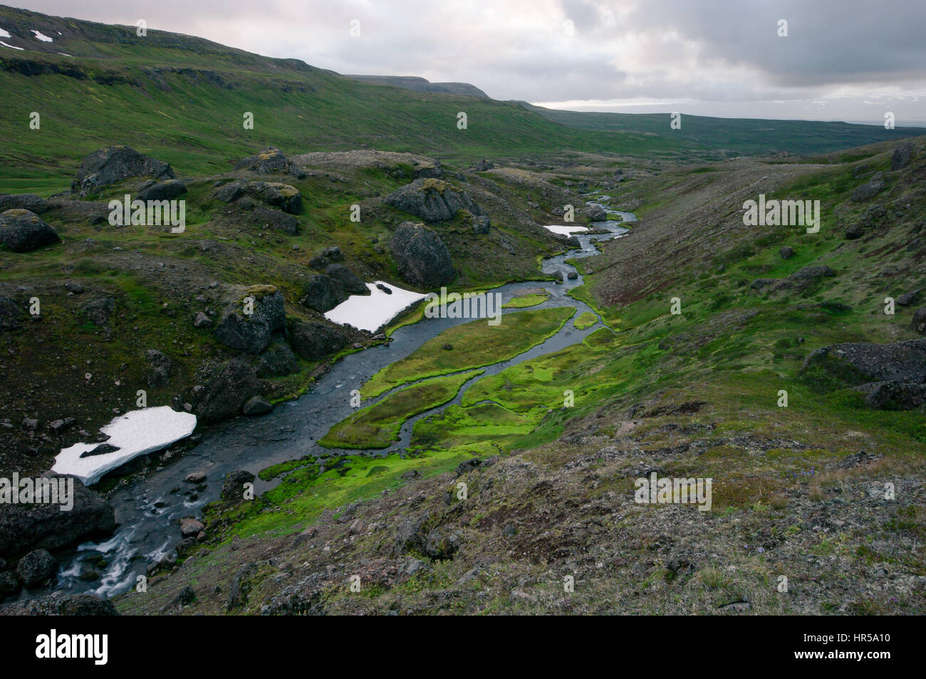 Overlooking river of snowmelt in valley in northeast Iceland Stock ...