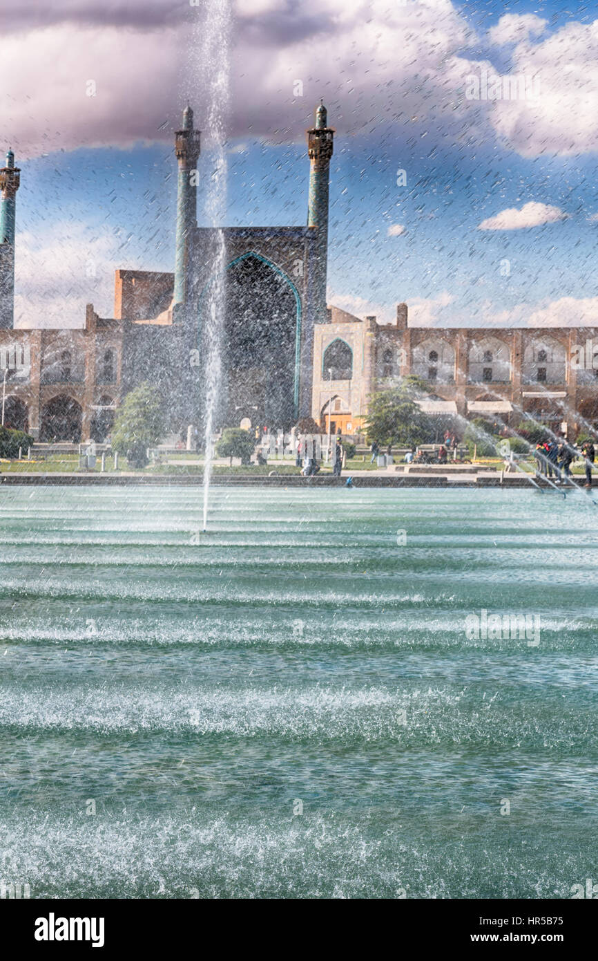 in iran old square mosque and fountain water backlight Stock Photo - Alamy