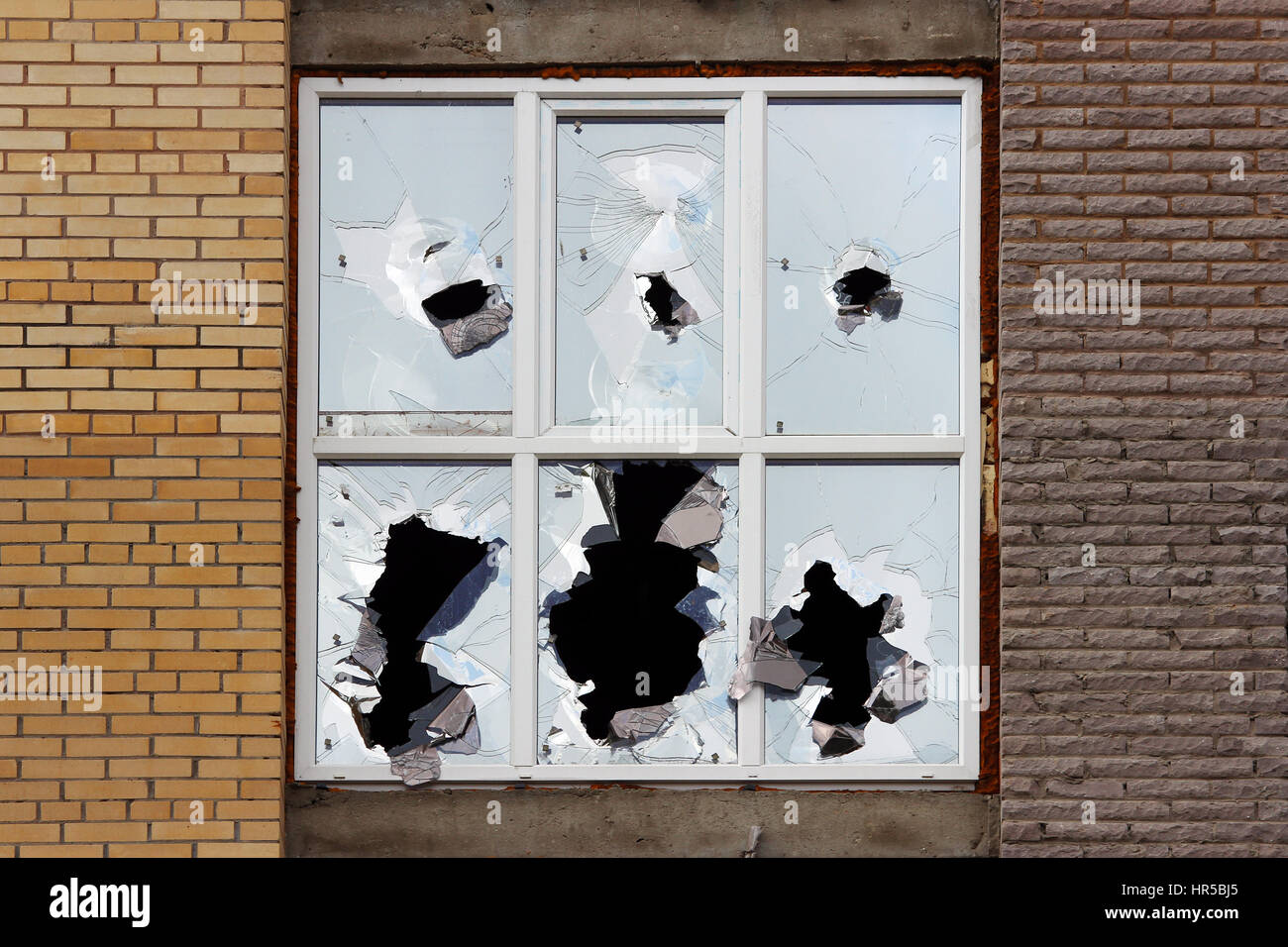 Vandals smashed the glass of windows of the an unfinished shopping mall ...