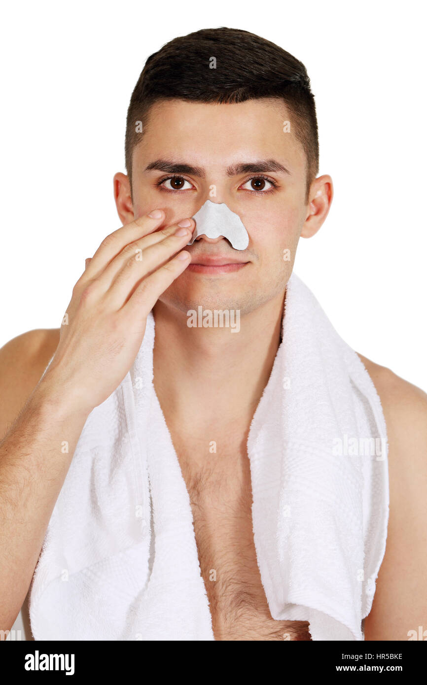 A man cleans the nose from black spots Stock Photo - Alamy