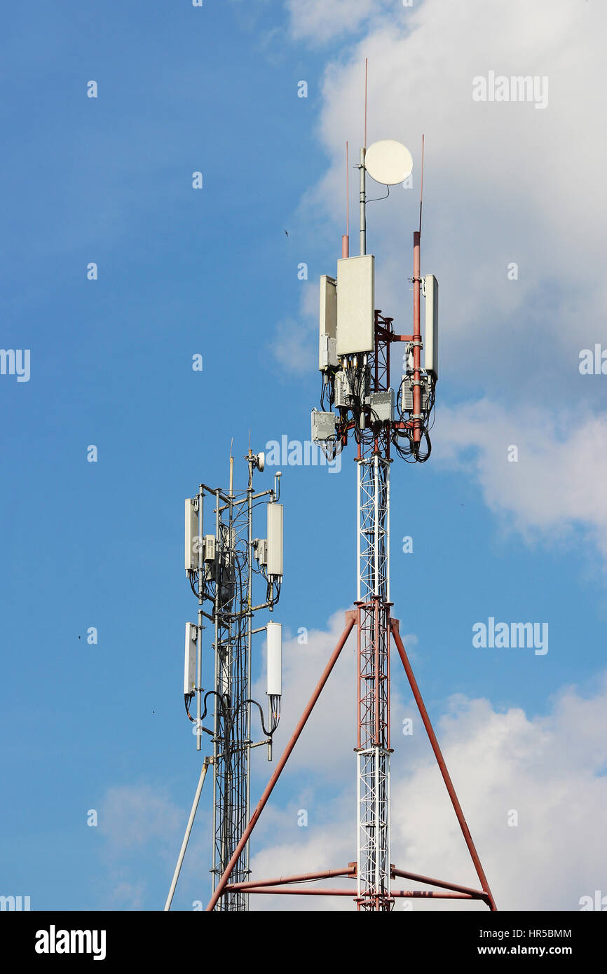 satellite dishes and plates on the spire of the tower for ...