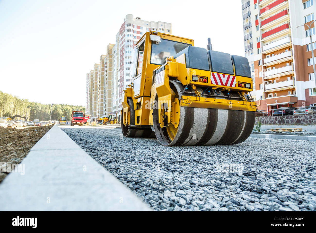 Road roller working at road construction site Stock Photo - Alamy