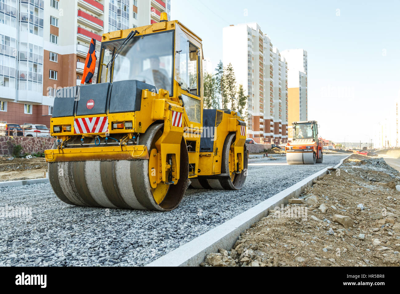 Road roller working at road construction site Stock Photo - Alamy