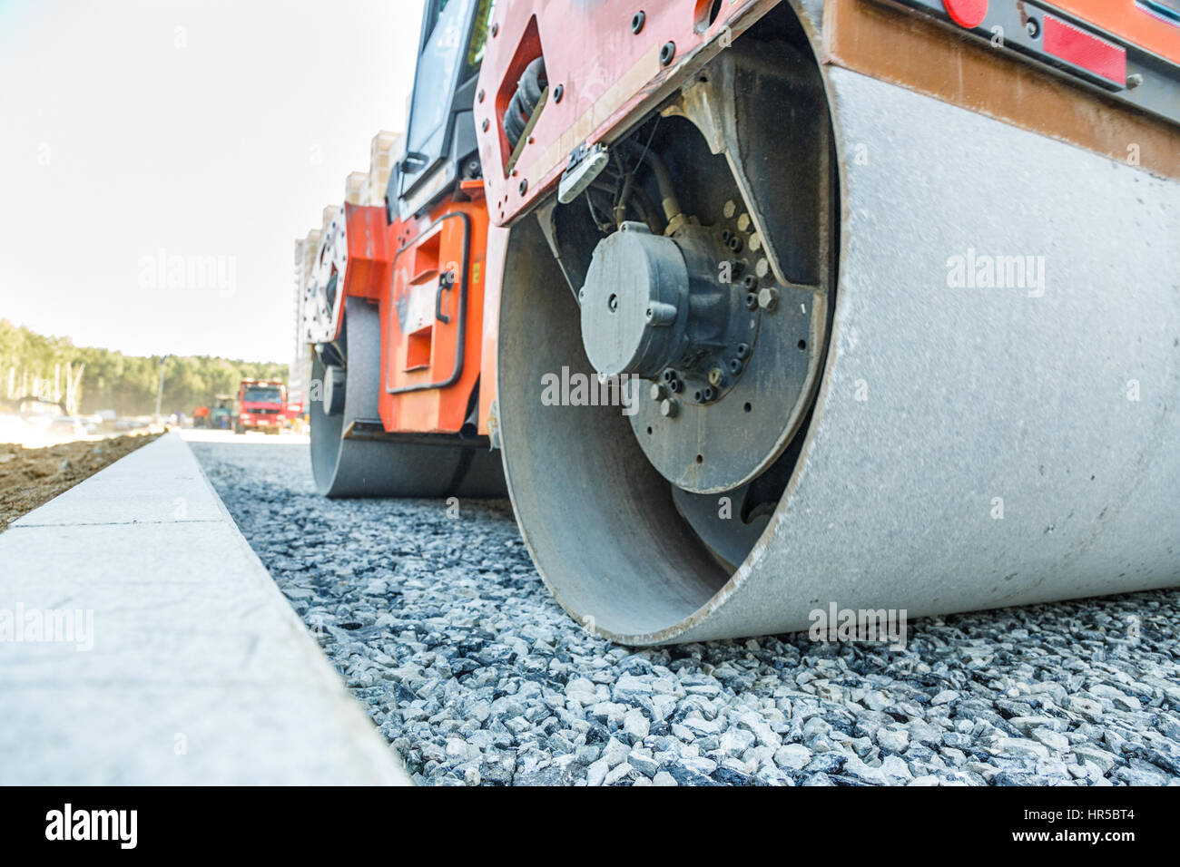 Road roller working at road construction site Stock Photo - Alamy