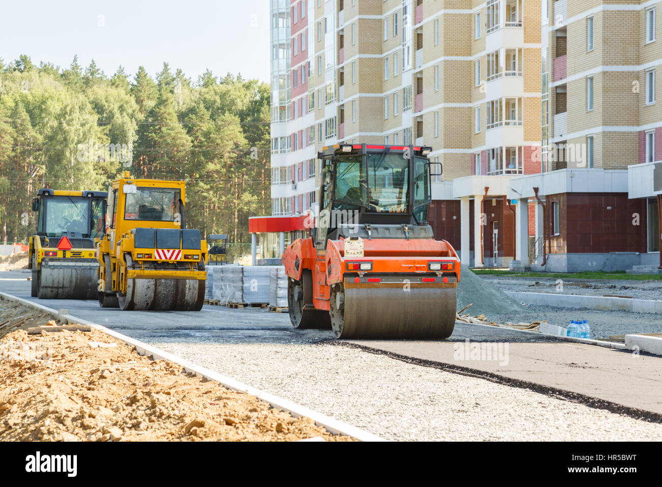 Road roller working at road construction site Stock Photo - Alamy