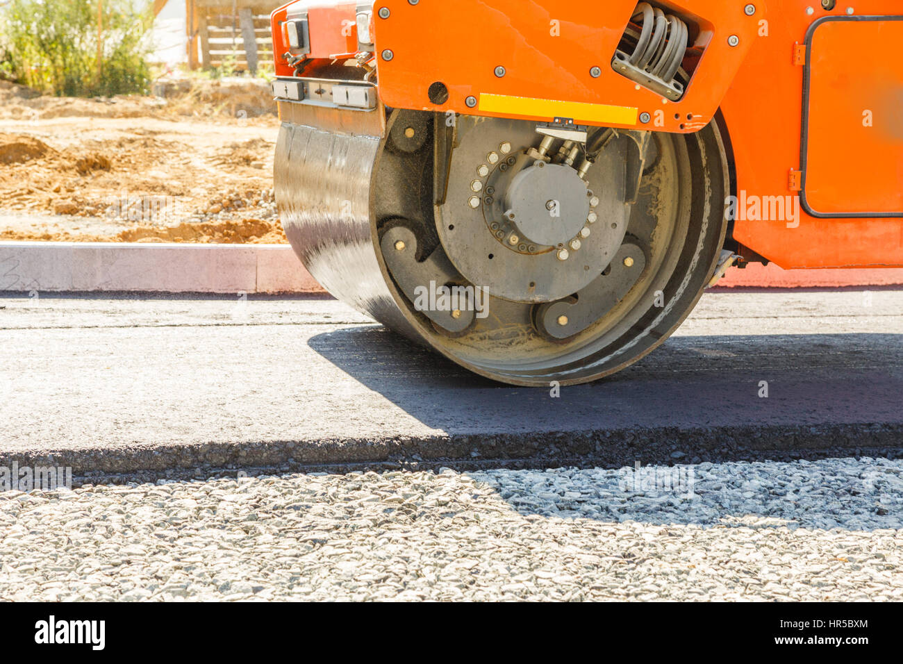 Road roller working at road construction site Stock Photo - Alamy