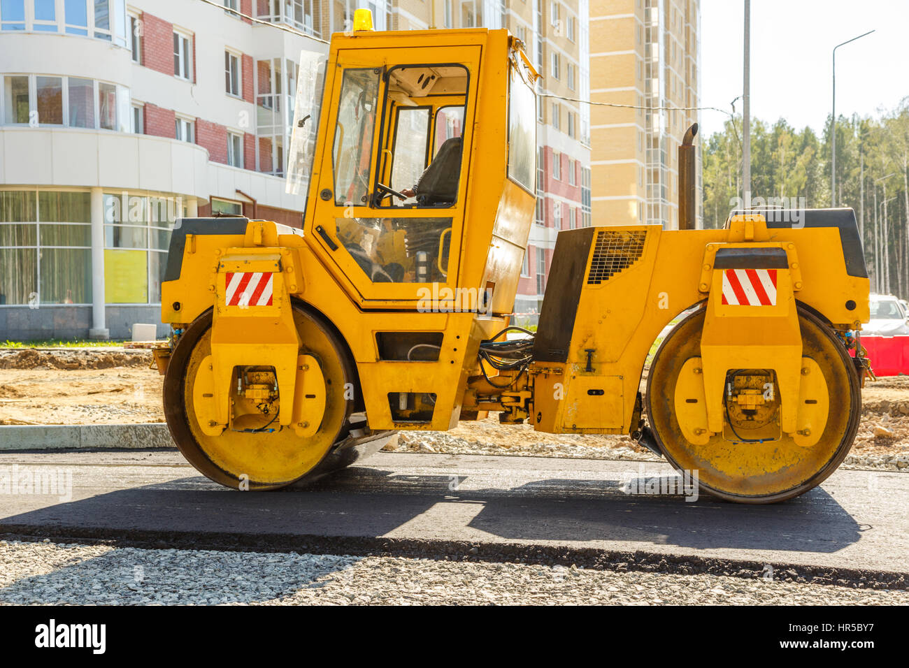 Road roller working at road construction site Stock Photo - Alamy
