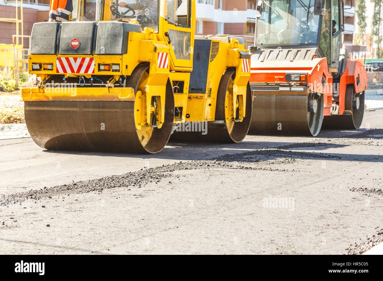 Road roller working at road construction site Stock Photo - Alamy