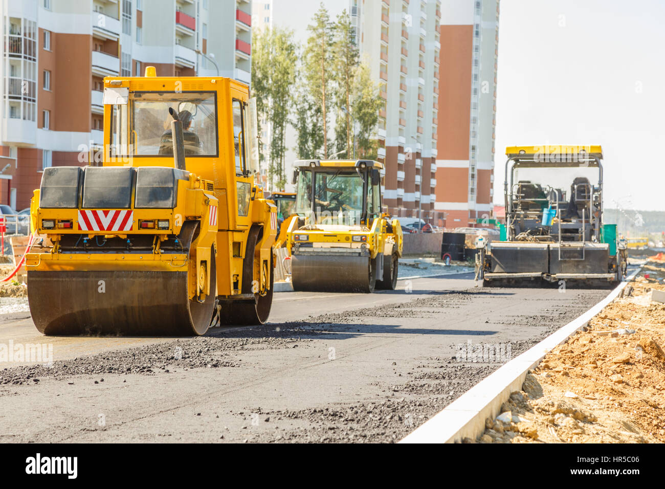 Road roller working at road construction site Stock Photo - Alamy