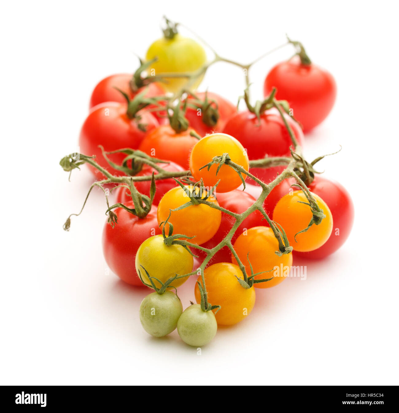 Fresh red and yellow tomatoes on white background Stock Photo - Alamy
