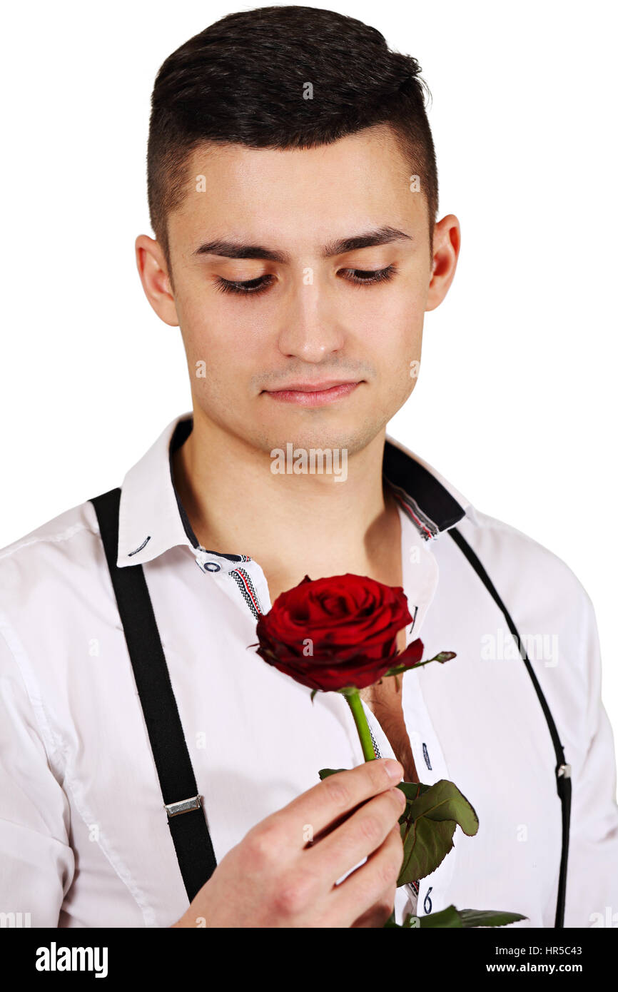A man with red rose in the hands. Valentine day Stock Photo - Alamy