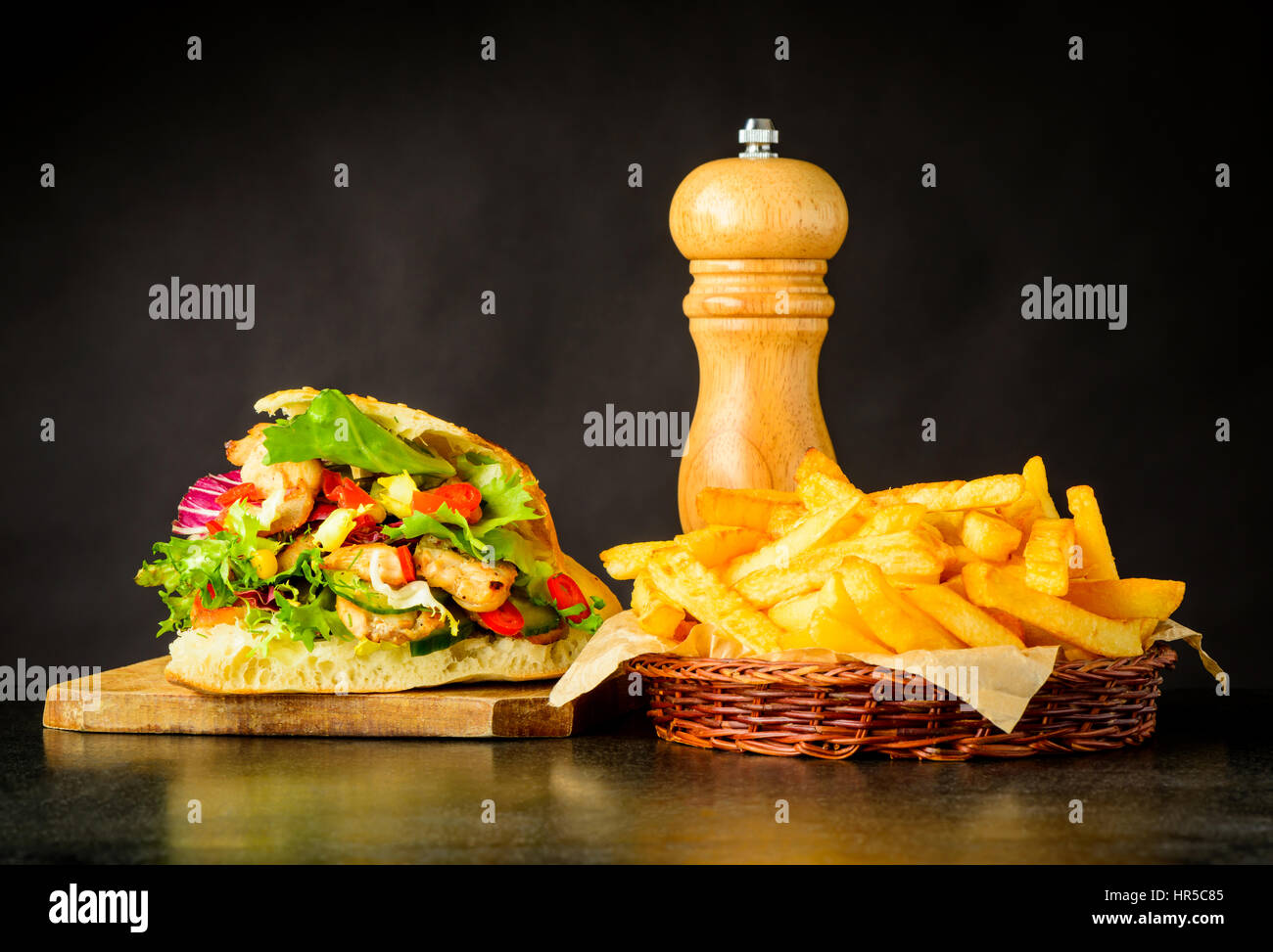 Doner Kebab Sandwich with French Fries and Salt grinder Stock Photo - Alamy