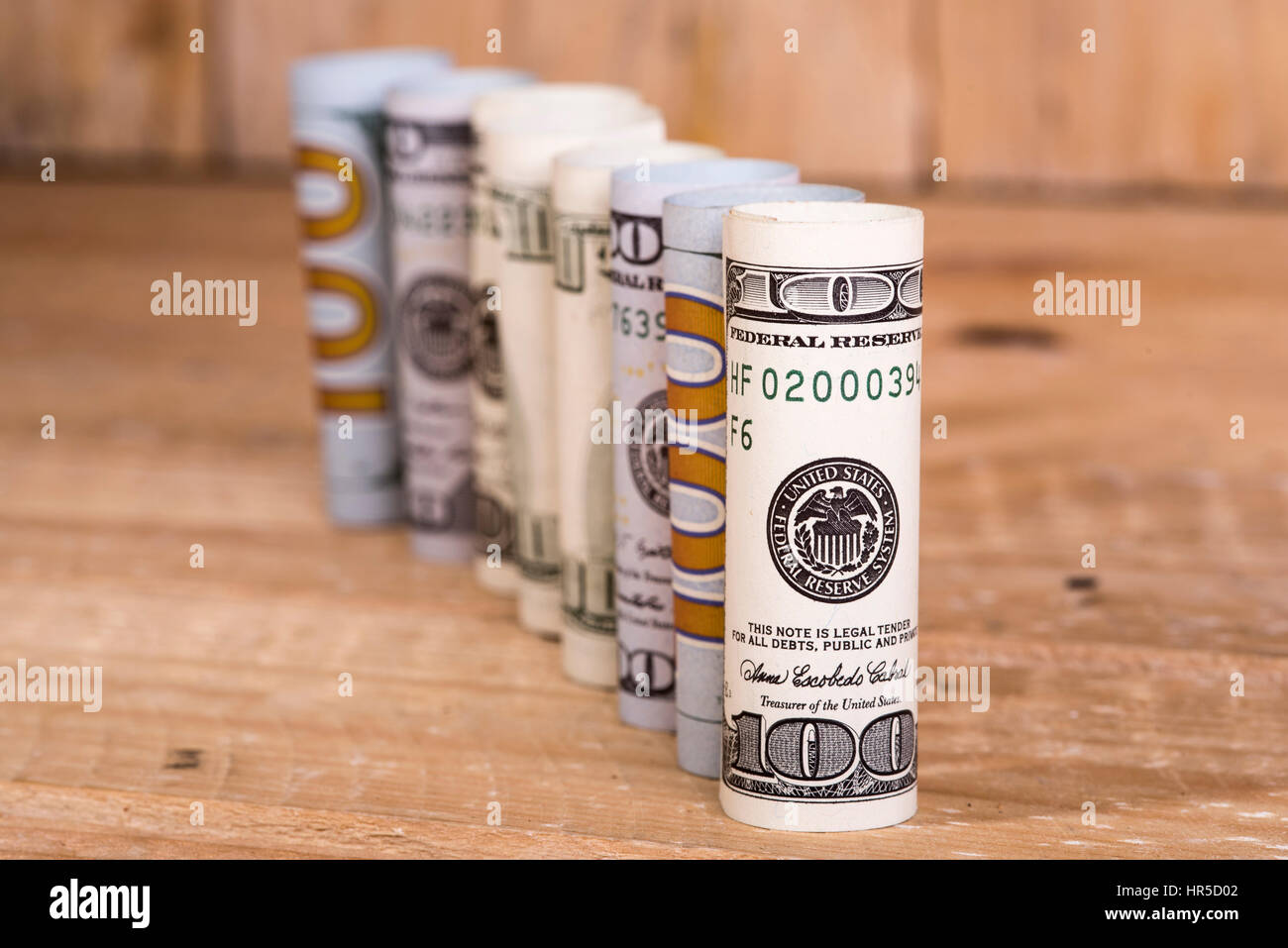 dollar bills tied with rubber band Stock Photo - Alamy