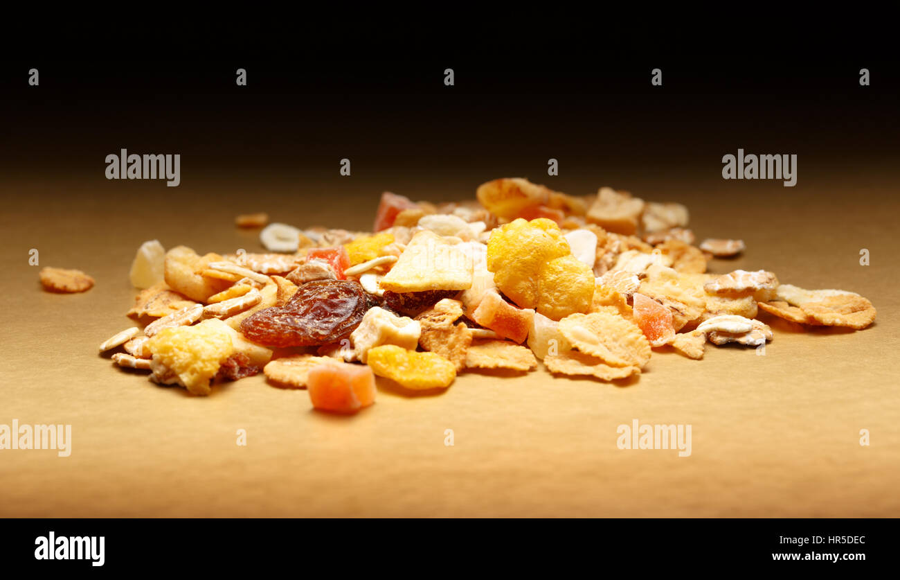 Heap of fresh musli with raisin on paper background Stock Photo - Alamy