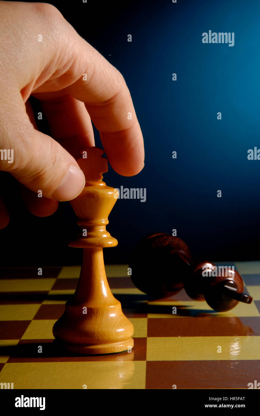 hand making a decisive and winning chess king move, checkmate Stock ...