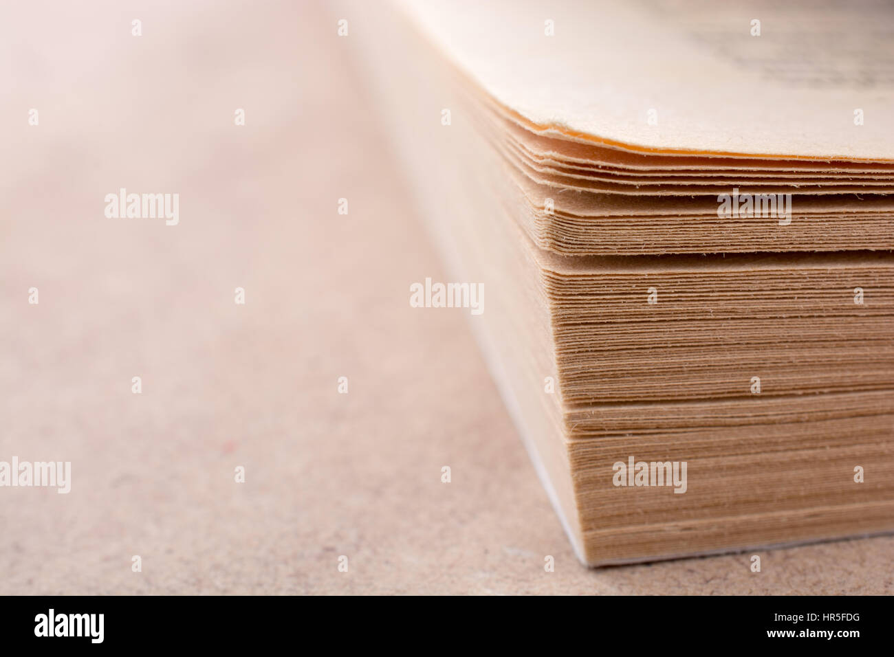 Book pages partly in view on white background Stock Photo - Alamy