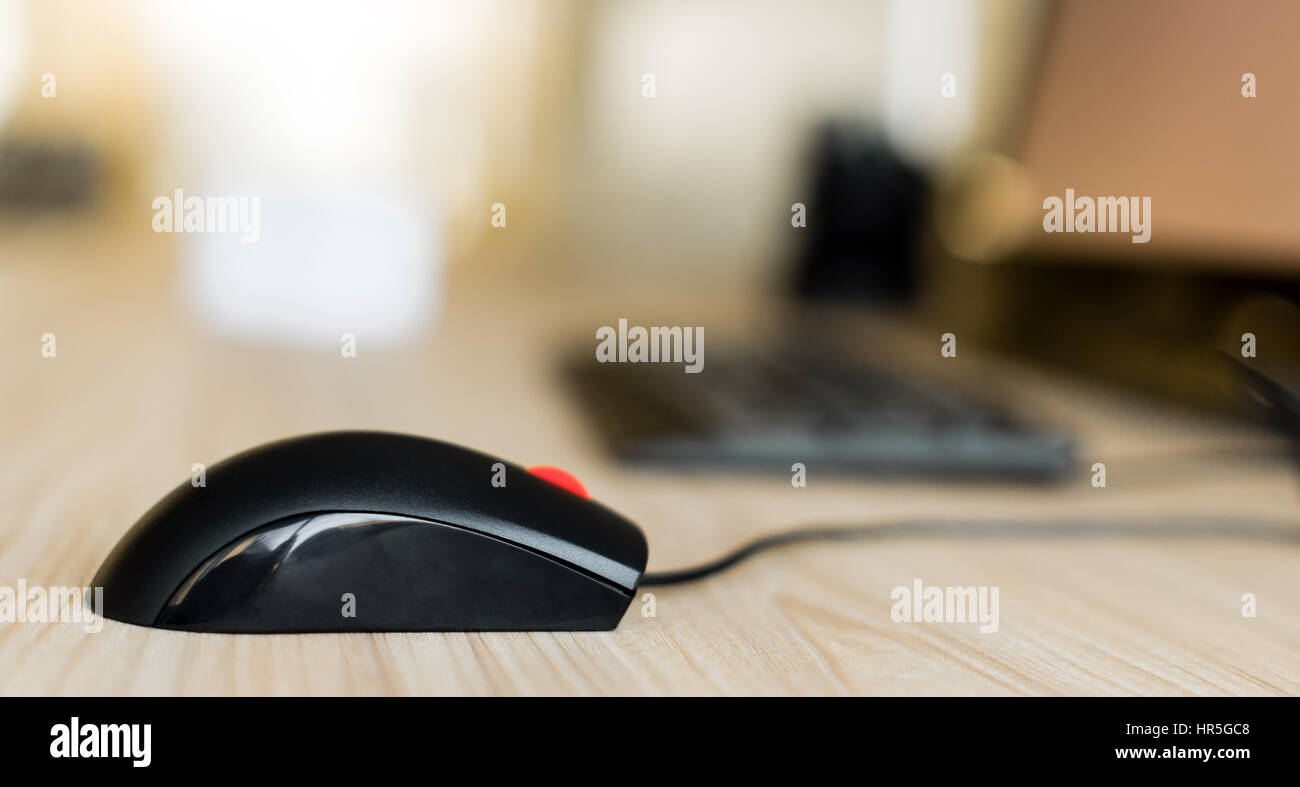 Computer Mouse on the Brown Wooden Desk. Side View Stock Photo - Alamy