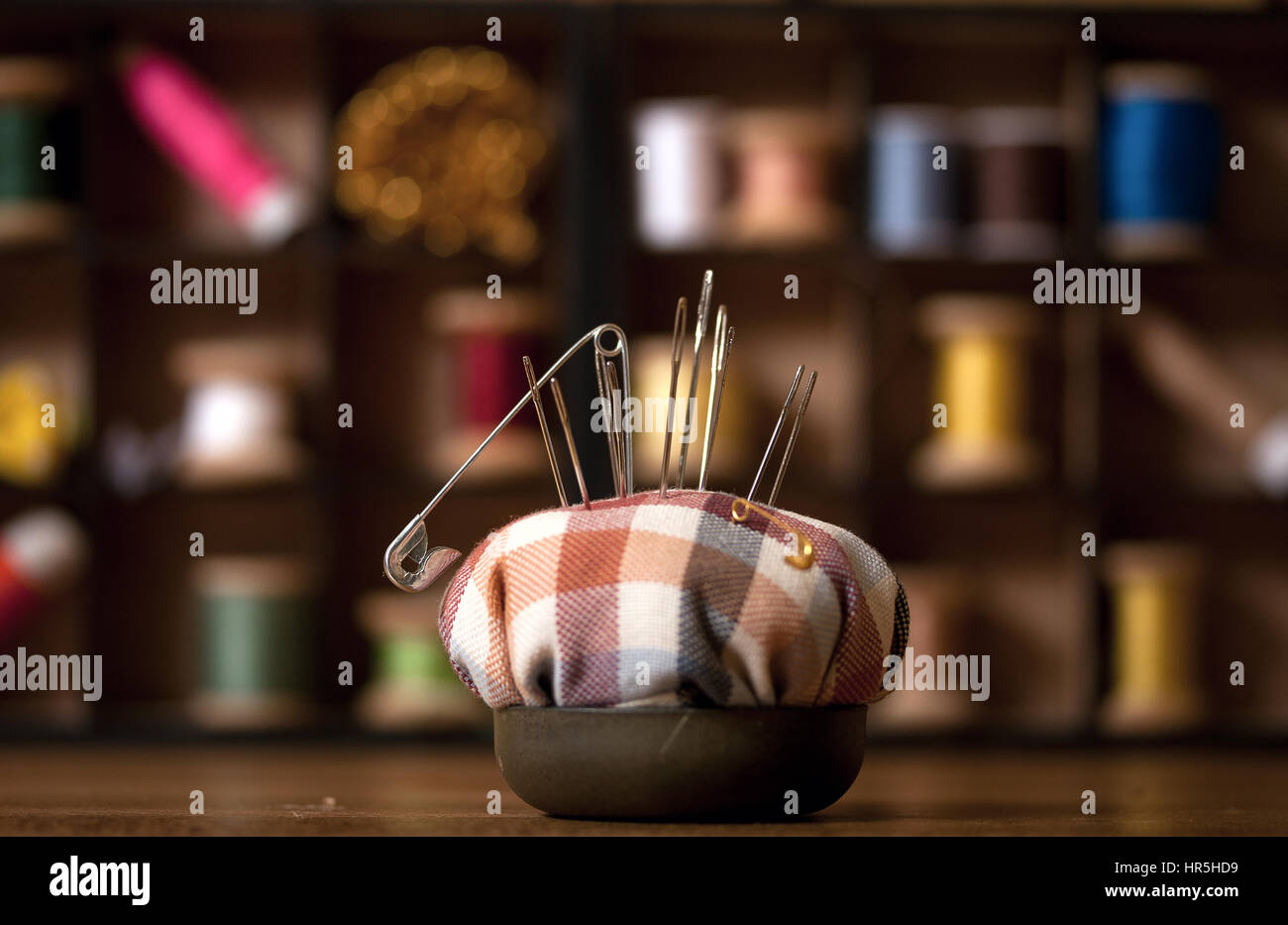 background is sewing accessories from Pincushion and pins in the ...