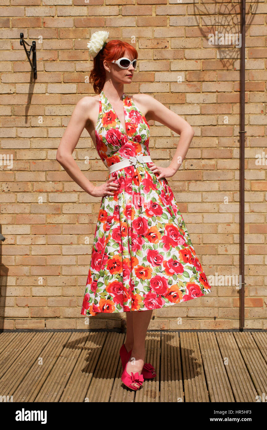 Burlesque performer and model Sensu'Elle in a red flowered dress ...