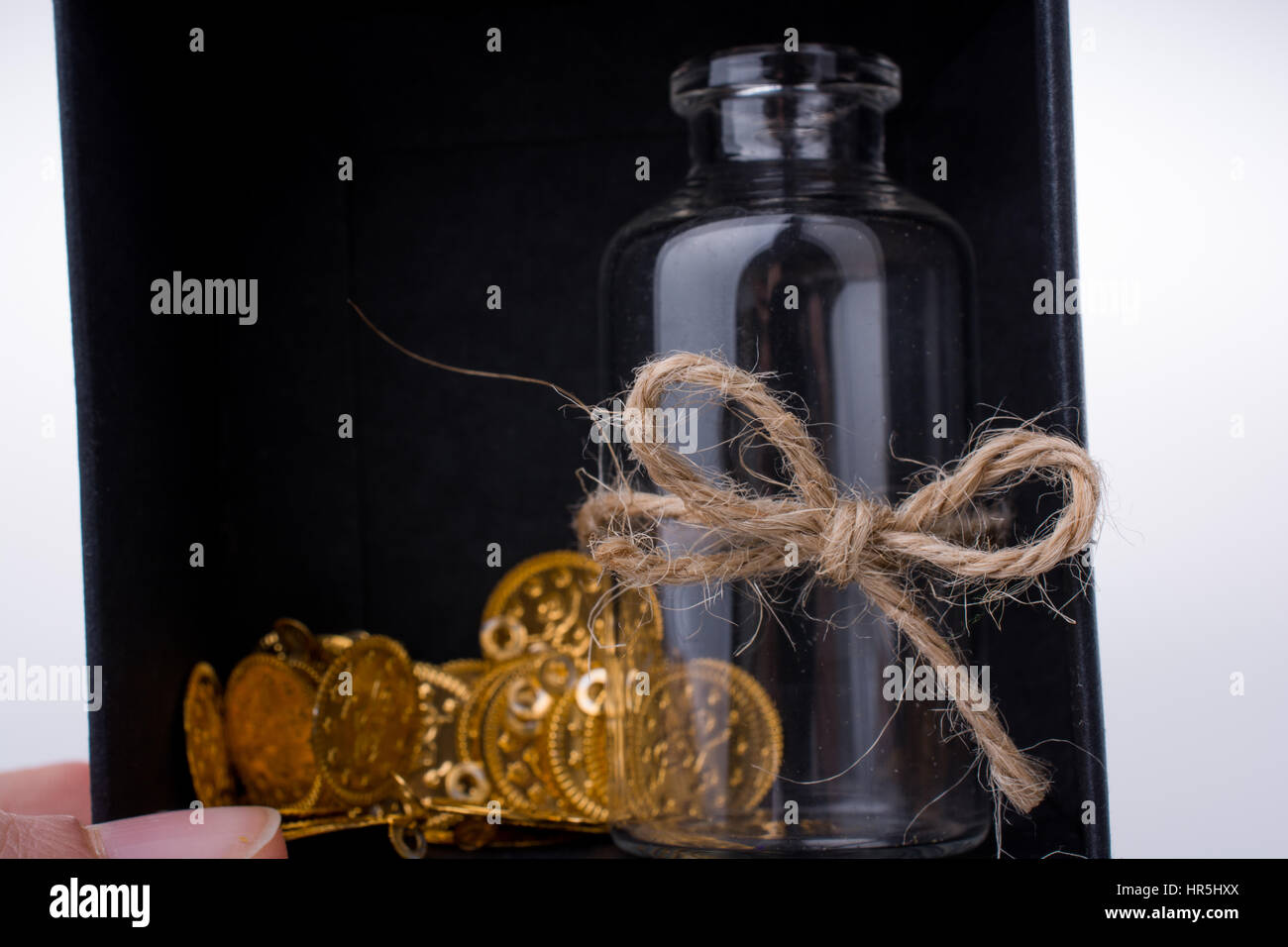 Gold coin in glass box hi-res stock photography and images - Alamy