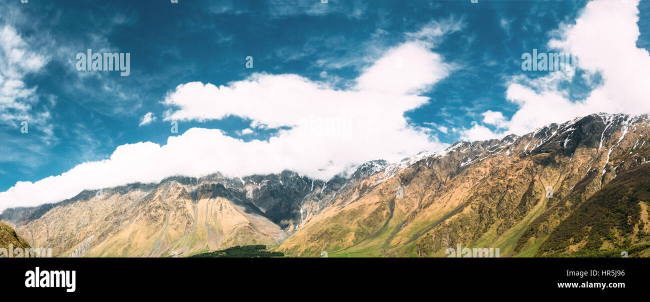 Panorama Of Mountain Peaks Covered With Snow. Clouds Over Varied ...