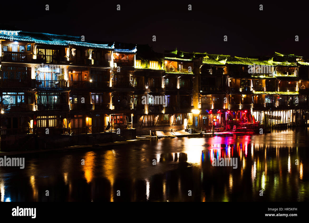 Fenghuang Ancient City streets at night.In tuojiang river on both sides ...