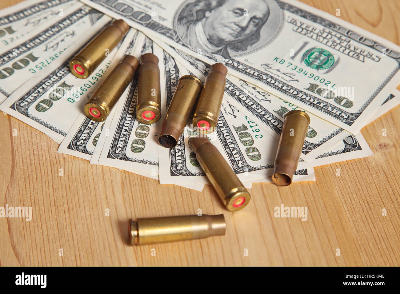 The used bullet shells and dollars Stock Photo - Alamy