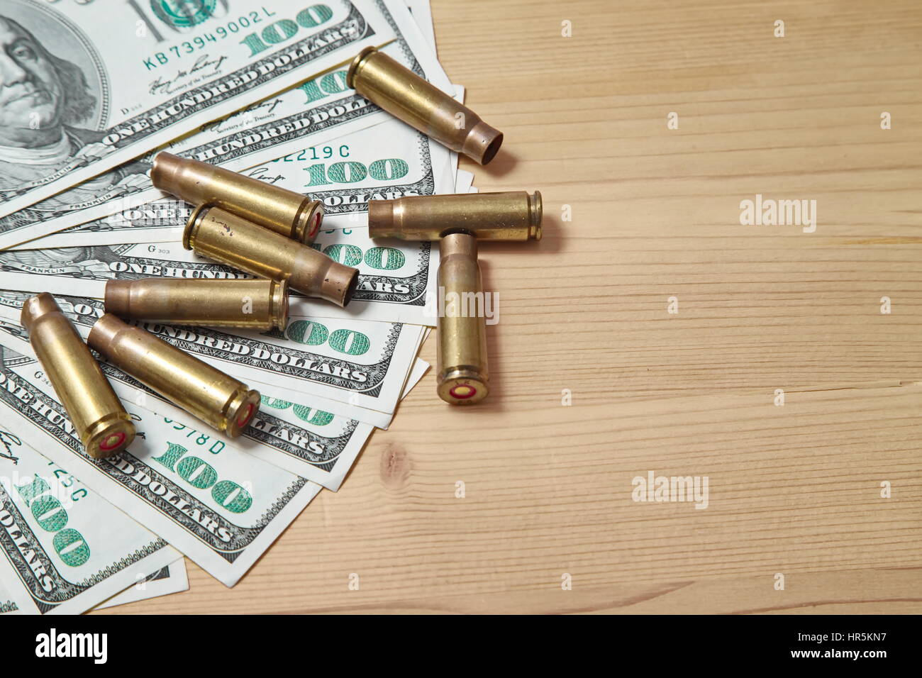 The used bullet shells and dollars Stock Photo - Alamy