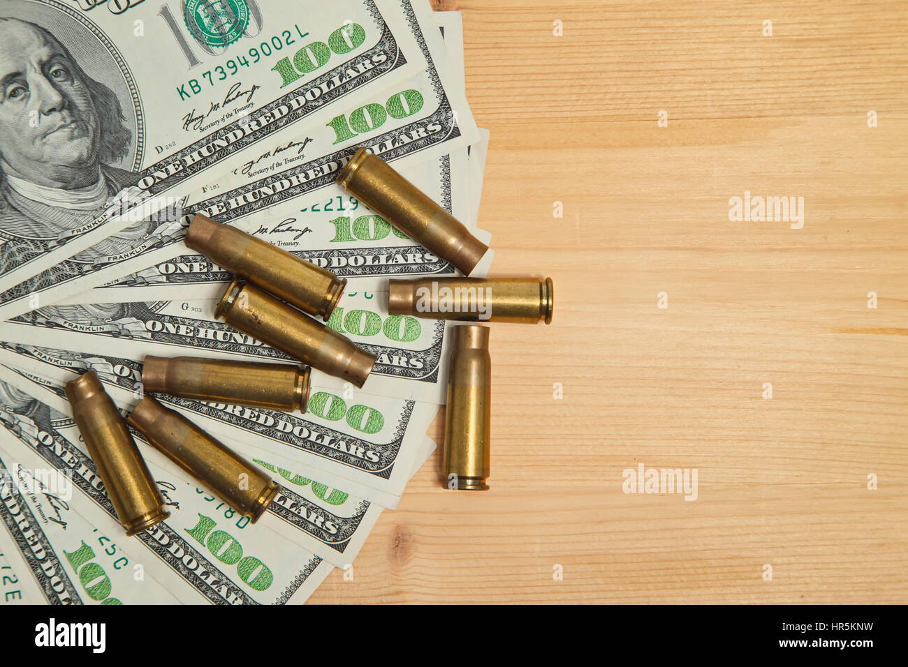 The used bullet shells and dollars Stock Photo - Alamy