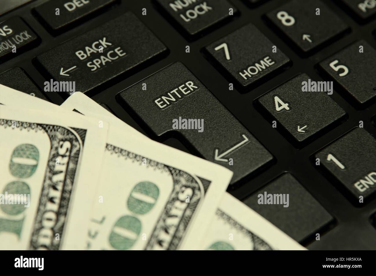 Dollar bill on keyboard hi-res stock photography and images - Alamy
