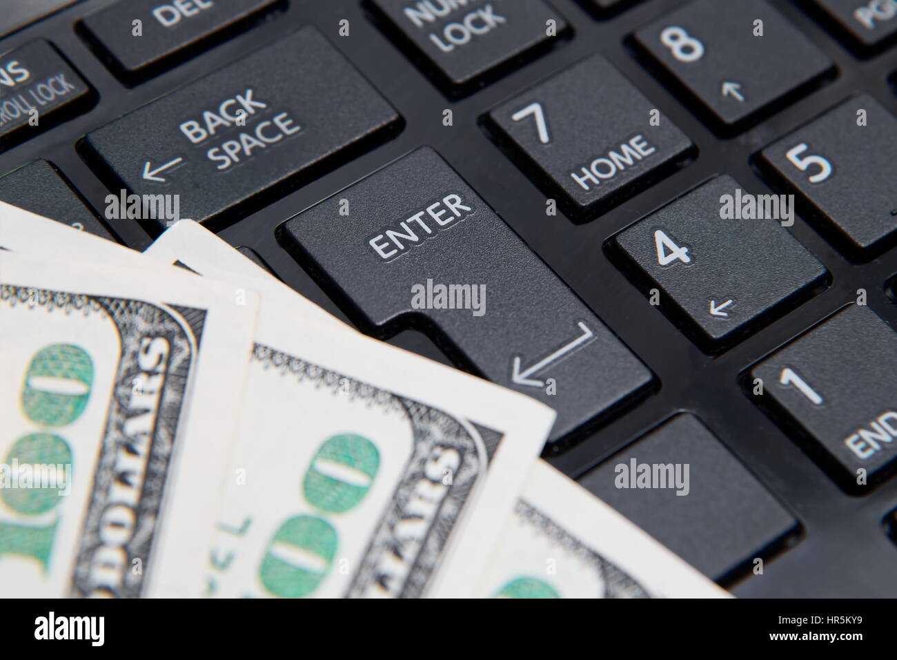 Dollar bill on keyboard hi-res stock photography and images - Alamy