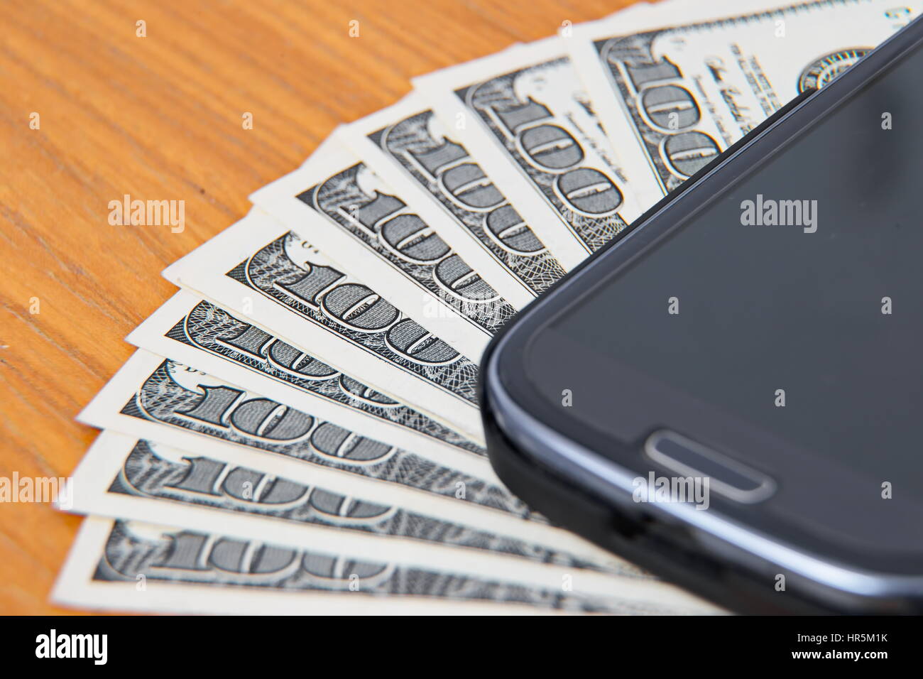 Mobile dollar hi-res stock photography and images - Alamy