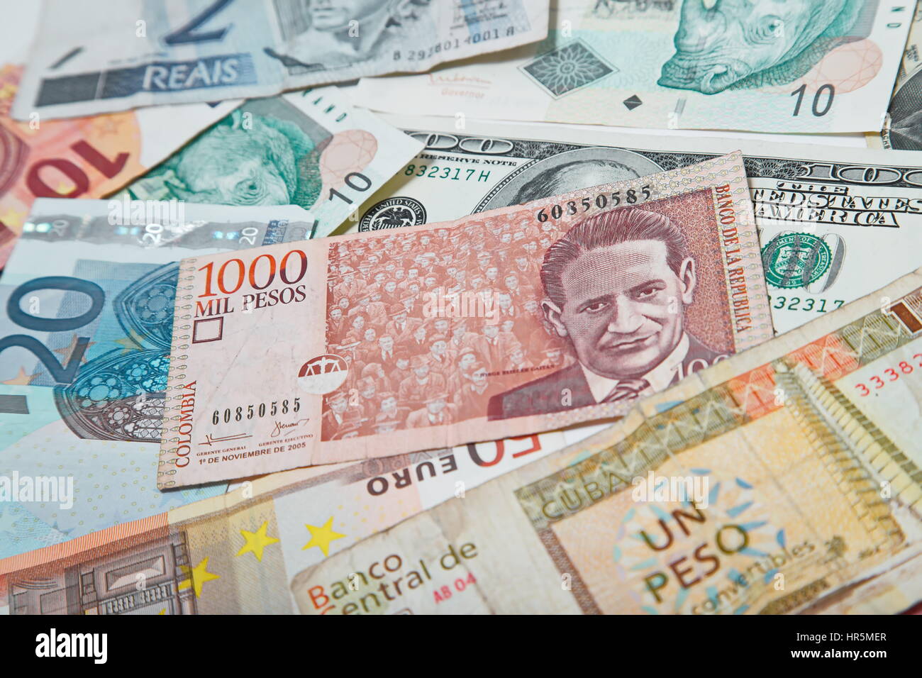 Background from paper money of the different countries. Colombian peso ...