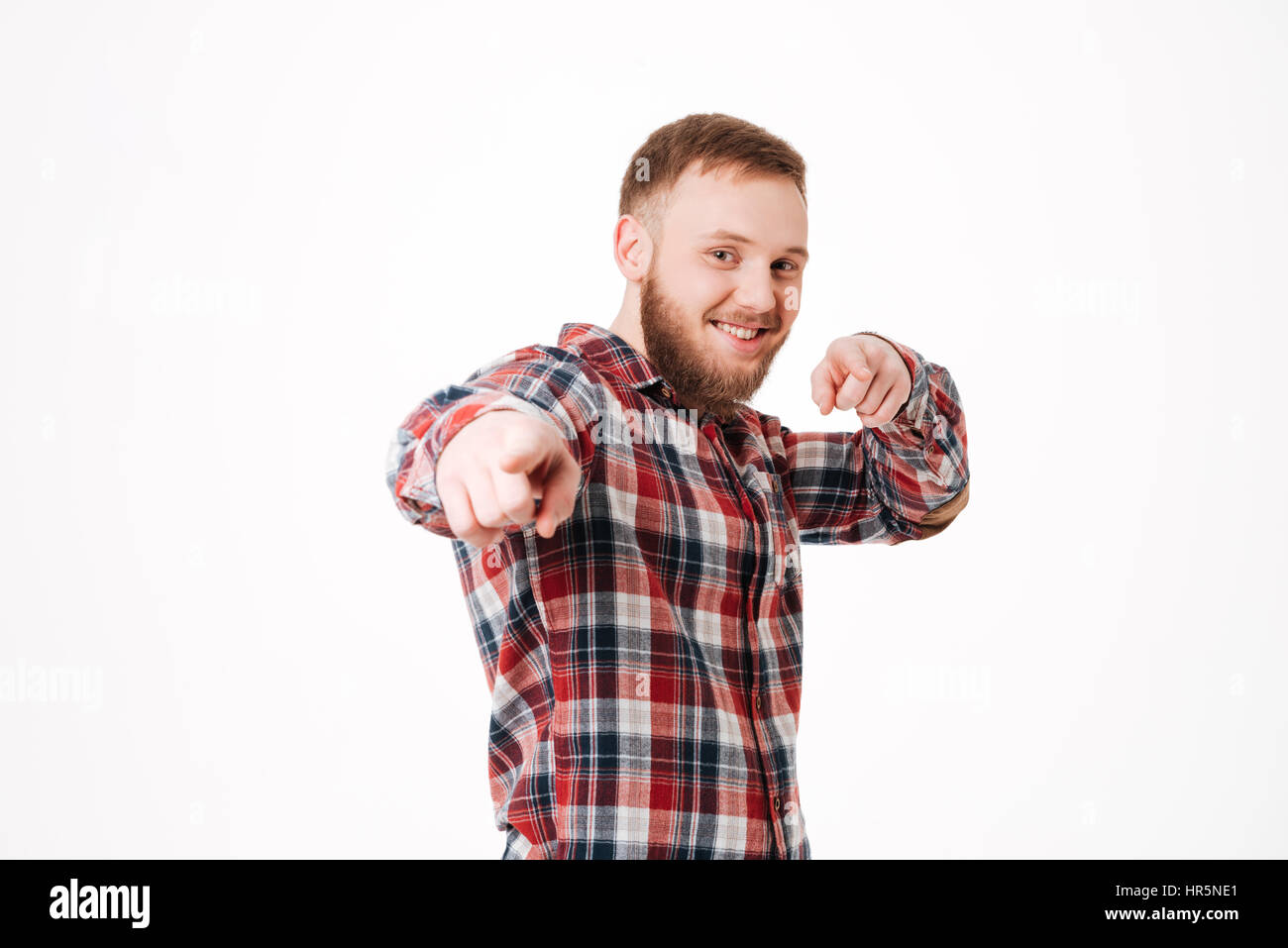 Smiling Bearded man in shirt pointing at camera. Isolated white ...