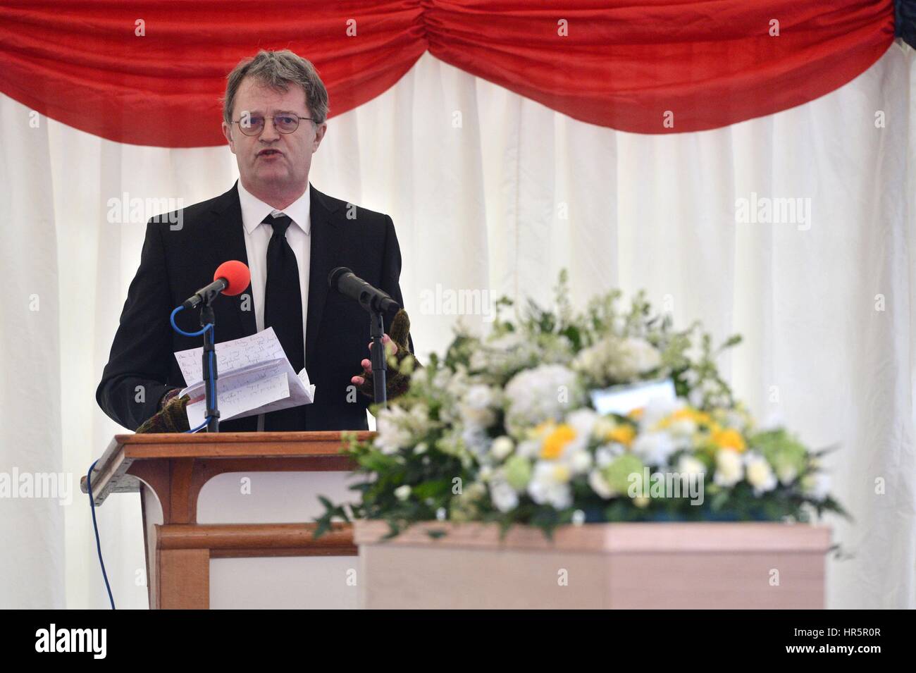 Paul Merton speaks at the funeral of Alan Simpson at Hampton & Richmond ...