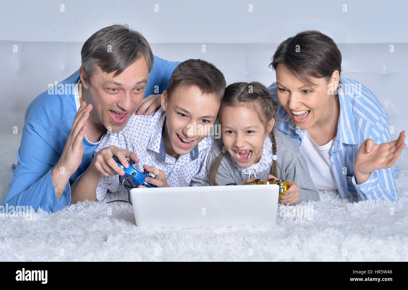 Smart kids with parents hi-res stock photography and images - Alamy