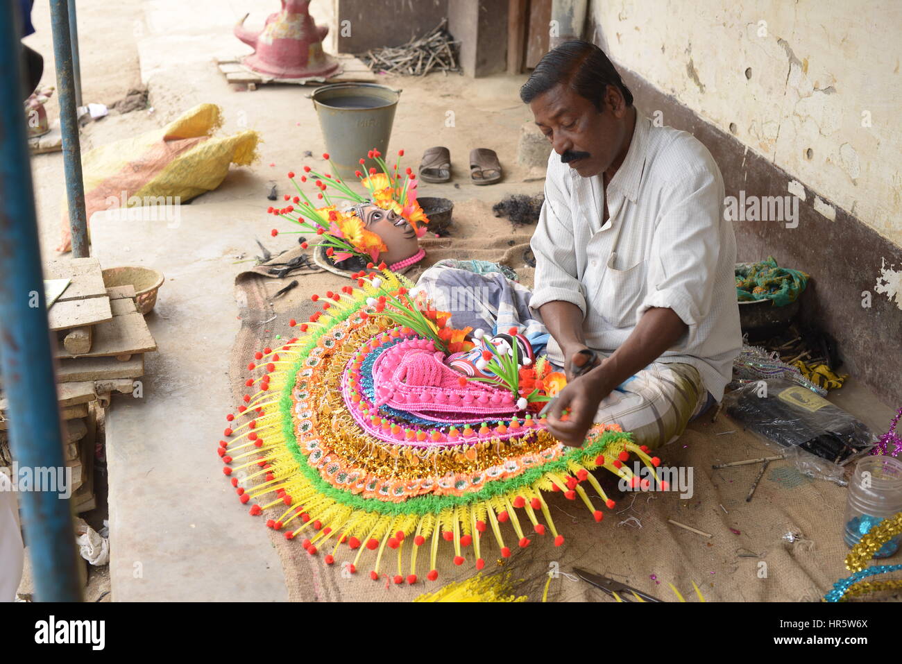 A Man Working on chow dance mask in Purulia, West Bengal Stock Photo ...