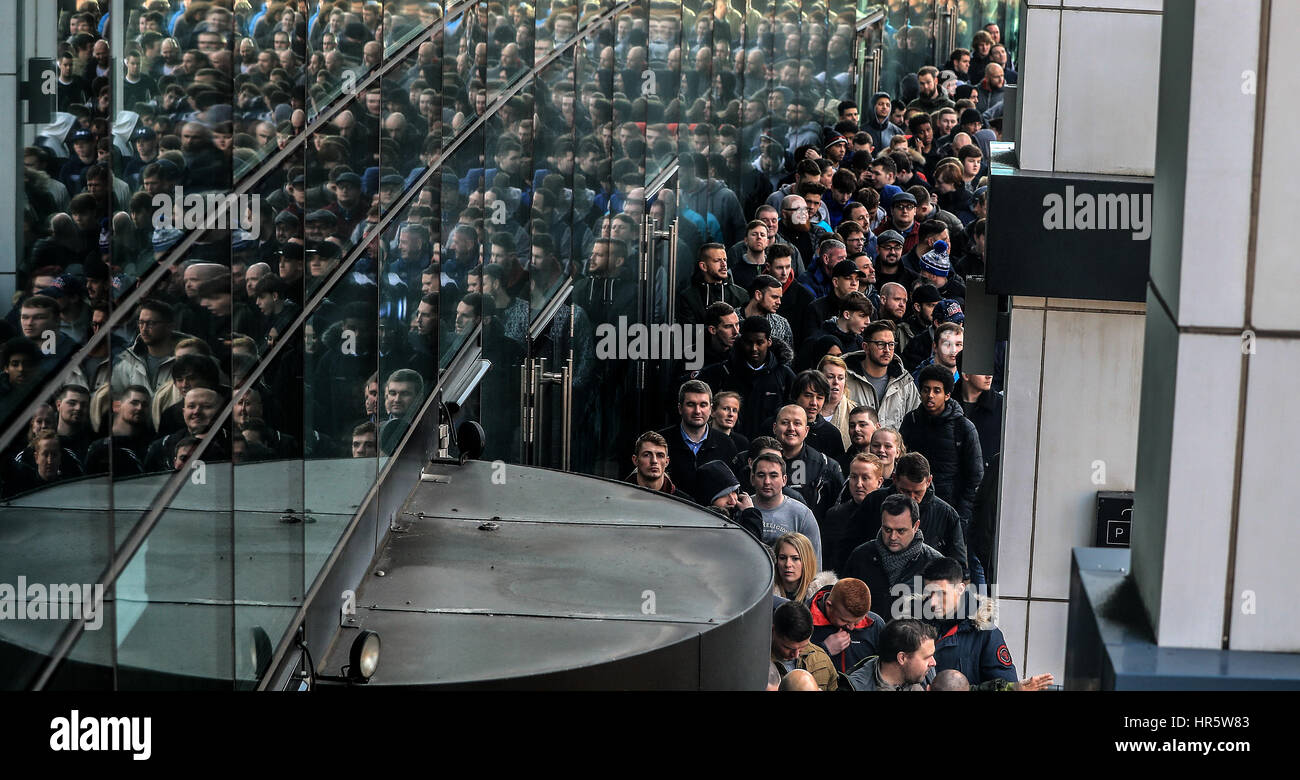 Crowds queue outside the hotel for the press conference at the Hilton ...