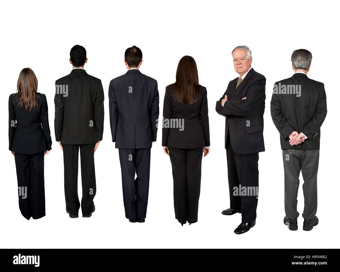 business people in a series with a senior boss standing facing the ...